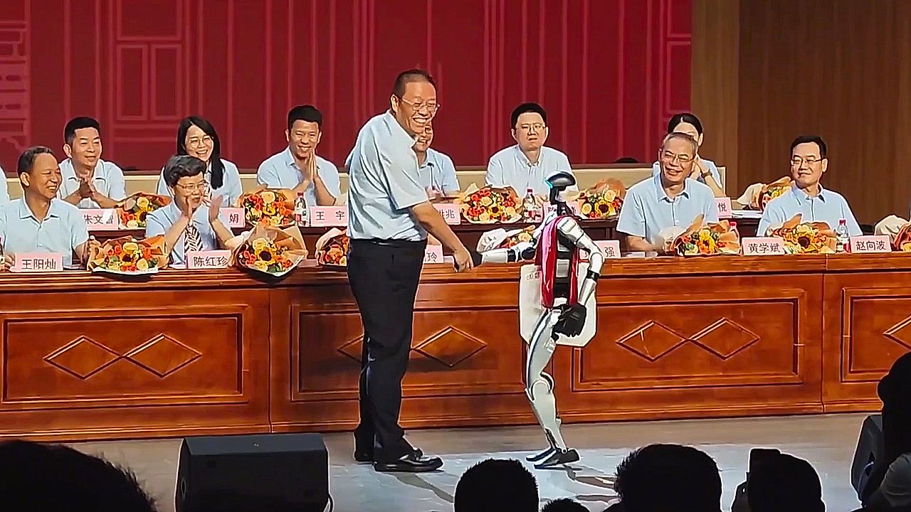 Humanoid robot receives certificate during high school graduation ...