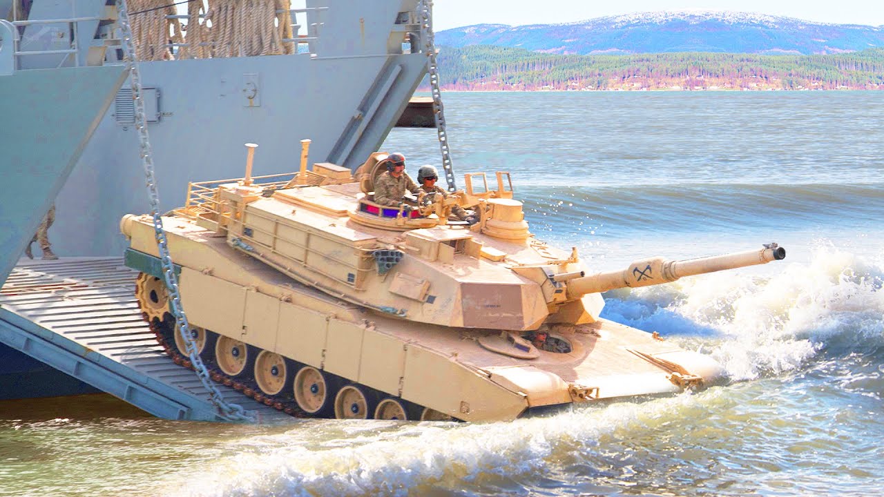 US tank weighing 60 tons makes a dramatic entry into the water at beach ...