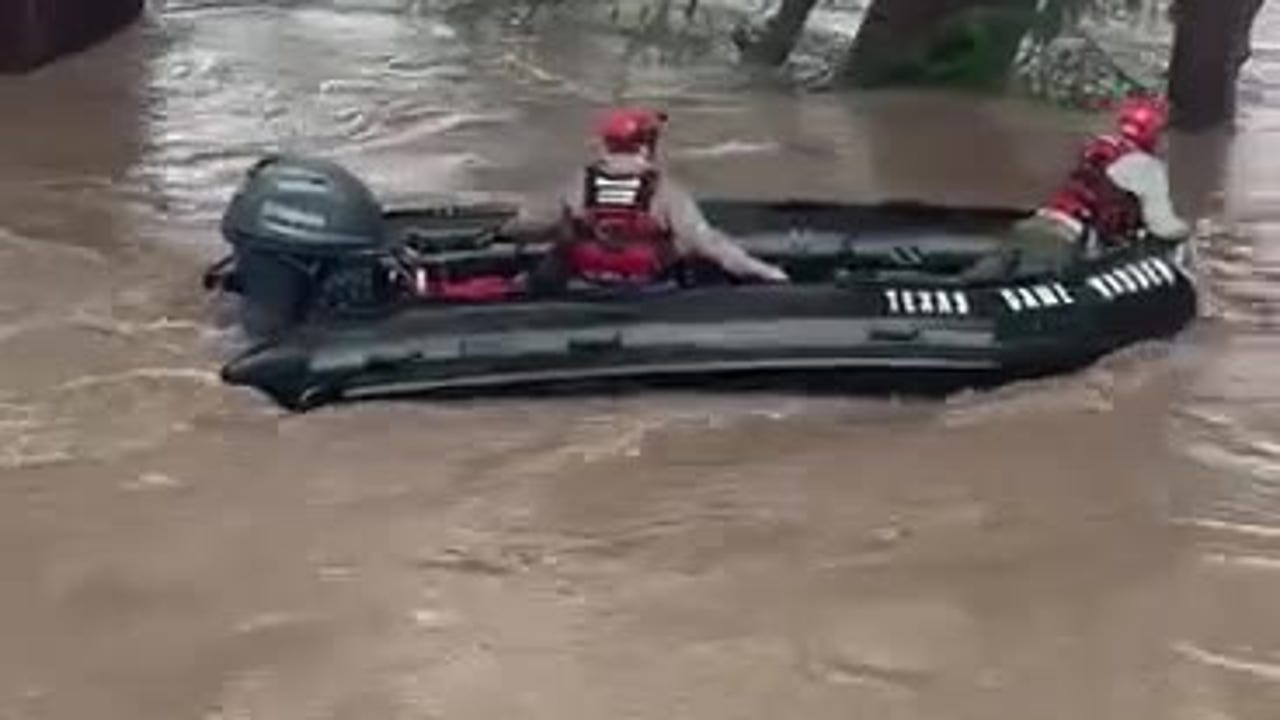 Texas flooding: Video shows woman's treetop perch after being swept away in Kerr County