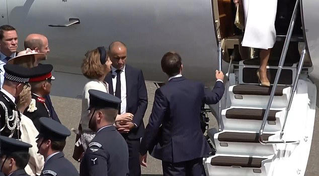 Macron and wife Brigitte put on a united front - after awkward morning