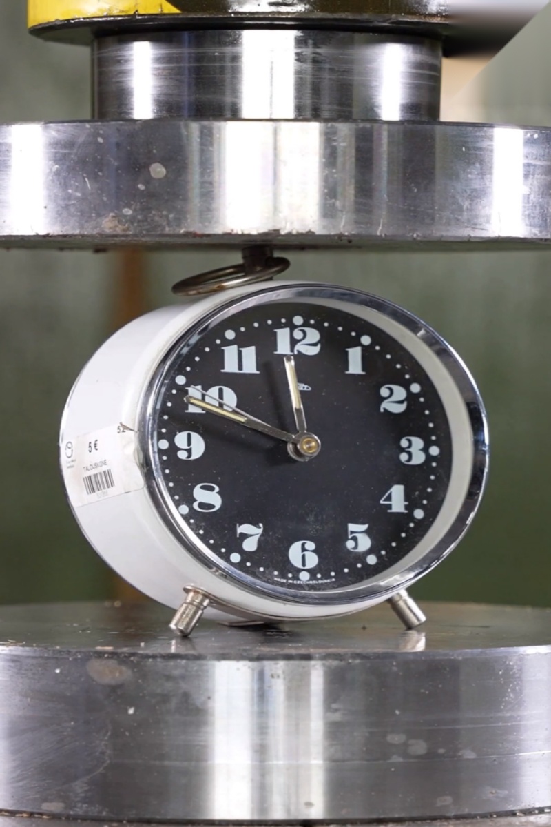 Crushing an Alarm Clock with Hydraulic Press