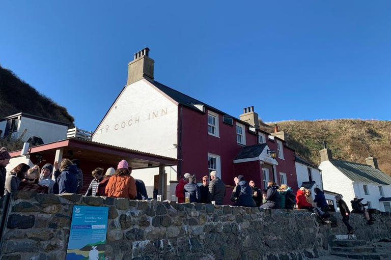 Tiny village with famous pub and 'whistling' sand you can only reach on ...