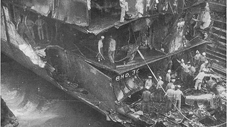 A torpedoed US Navy ship escaped the Pacific in reverse, using coconut logs. Its sunken bow has ...