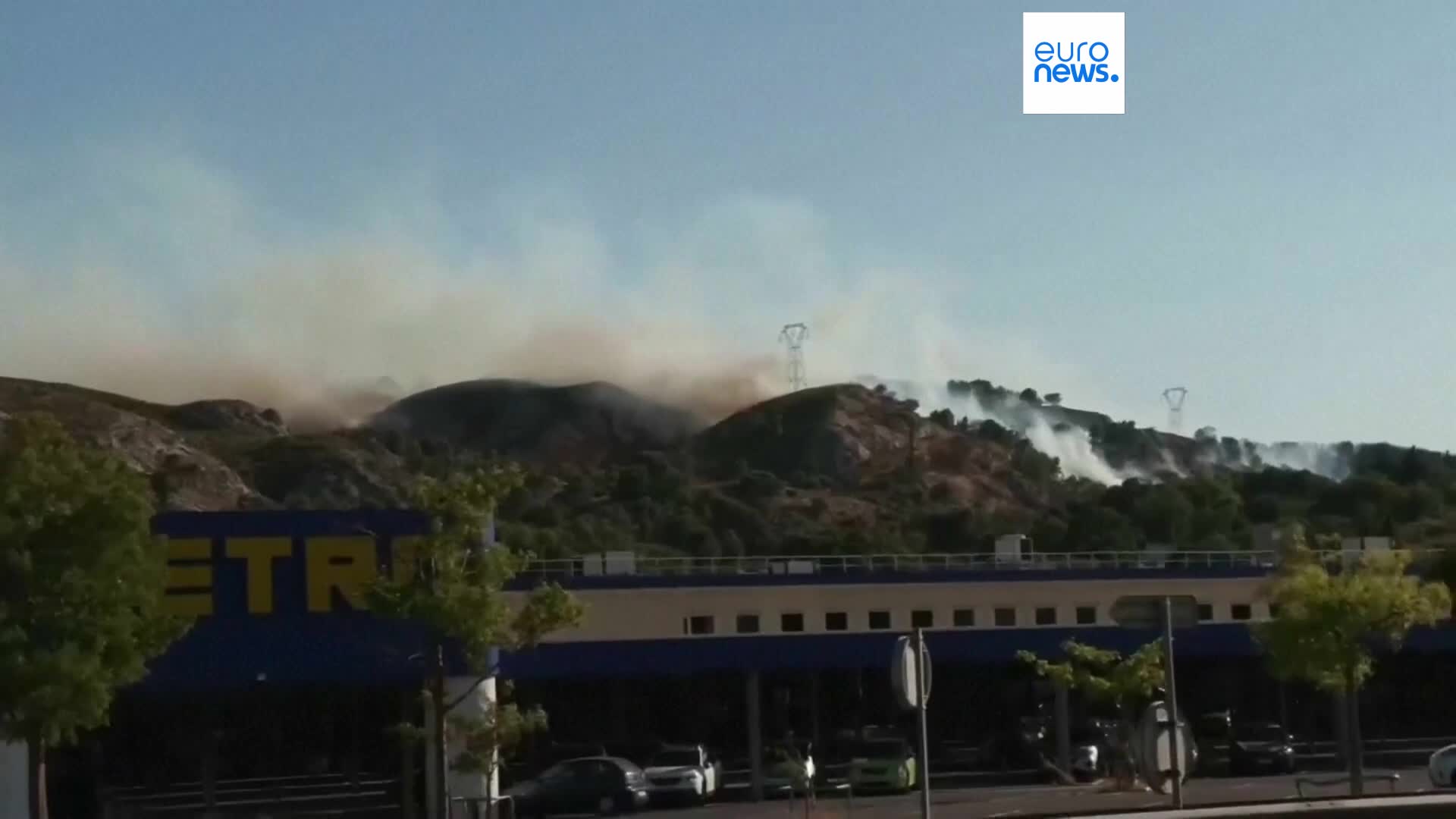 More than 100 injured and hundreds more evacuated as wildfire rages ...