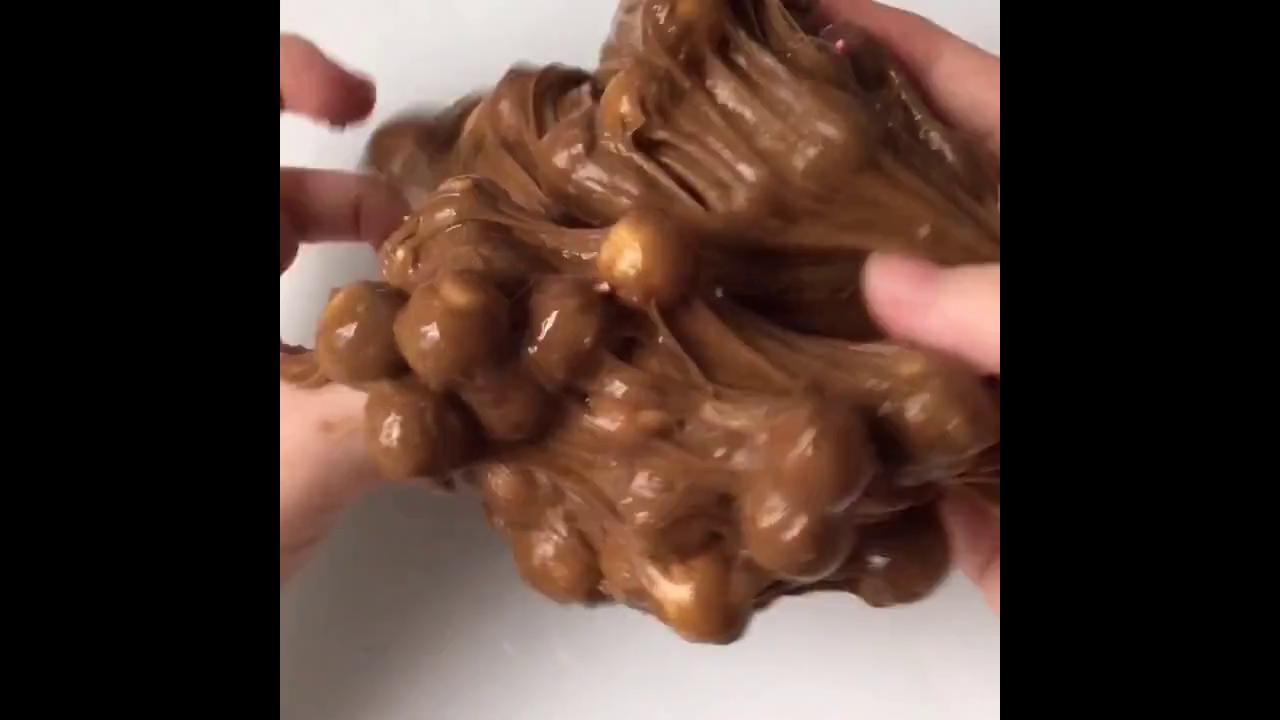 Satisfyingly Mashing Chocolate Brown Foam Balls On A Slime
