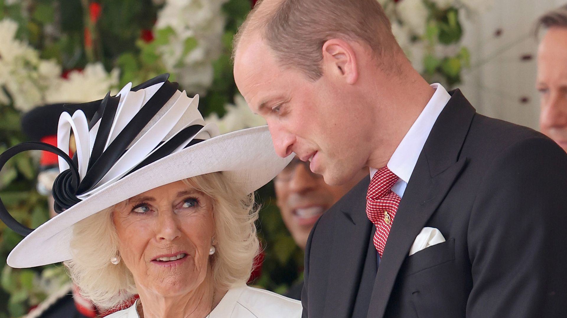Prince William kisses Queen Camilla in a rare display of affection