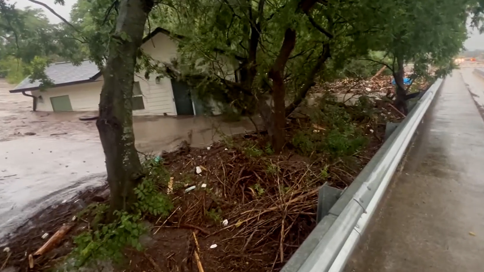 Texas floods: Moment house smashes into river bank in Center Point