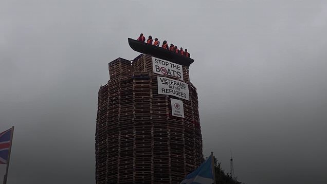 Calls for removal of migrant effigies in boat placed on loyalist ...