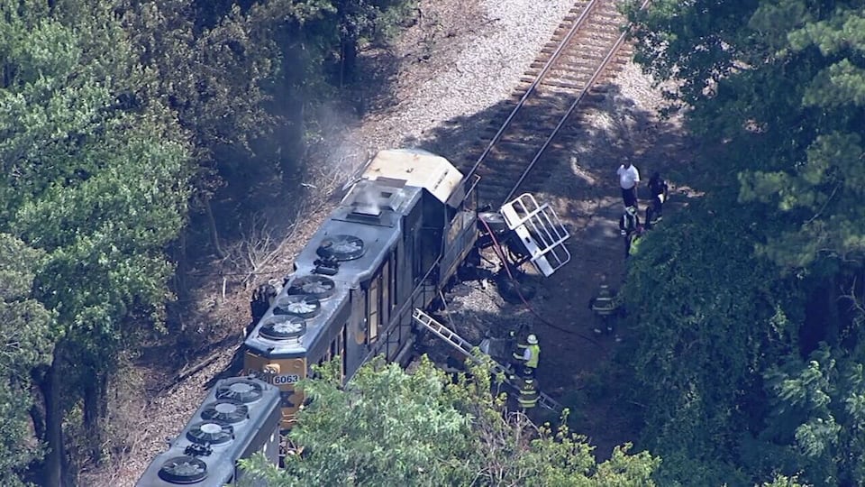 4 hurt when train hits truck