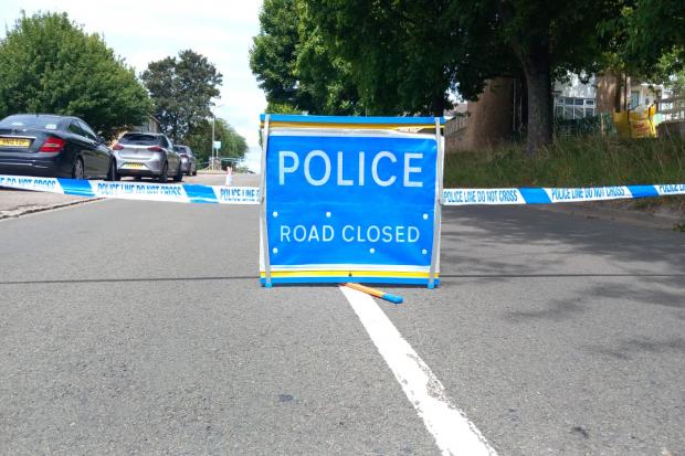 'Avoid the area' warning as police close road amid house fire