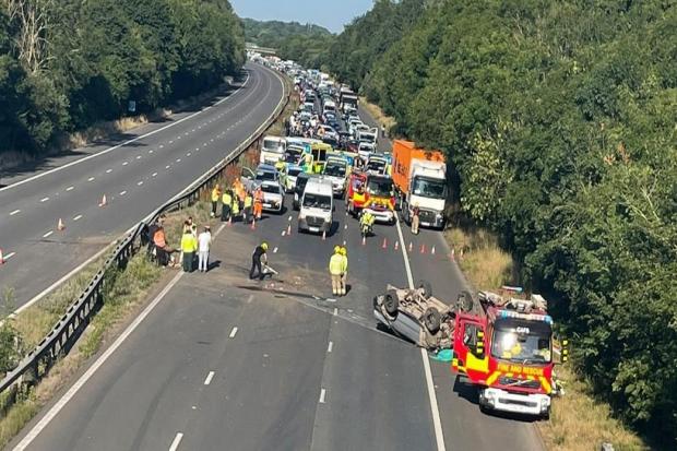Major four vehicle crash on M3 leaves car overturned and people left ...