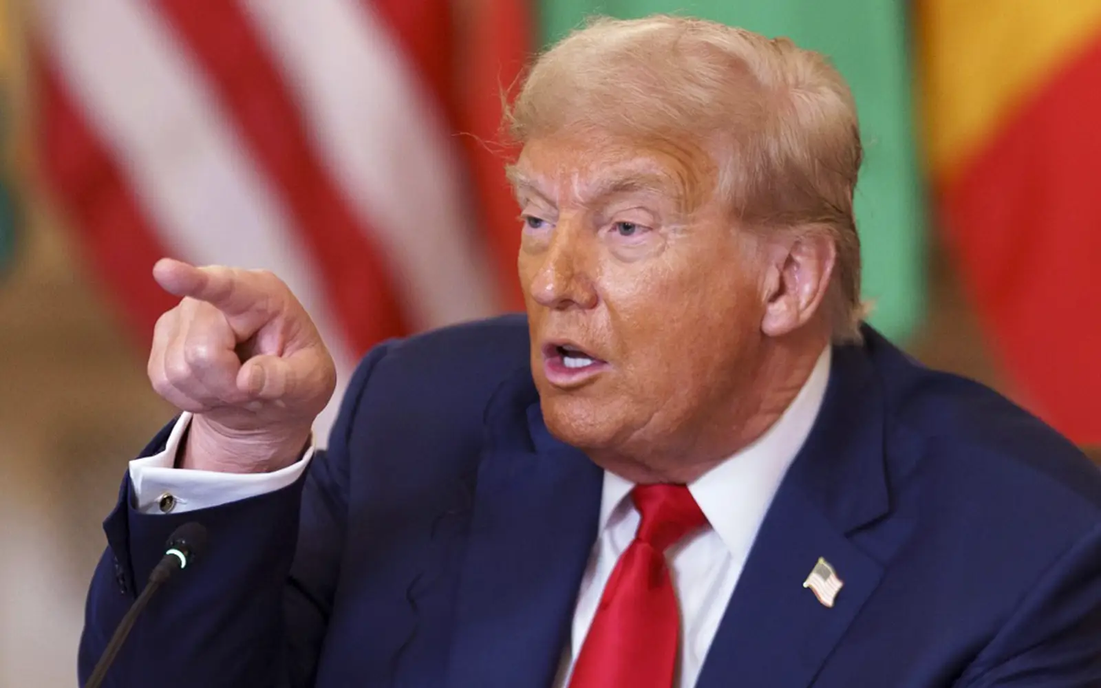 Trump flips off, curses at heckler during factory visit