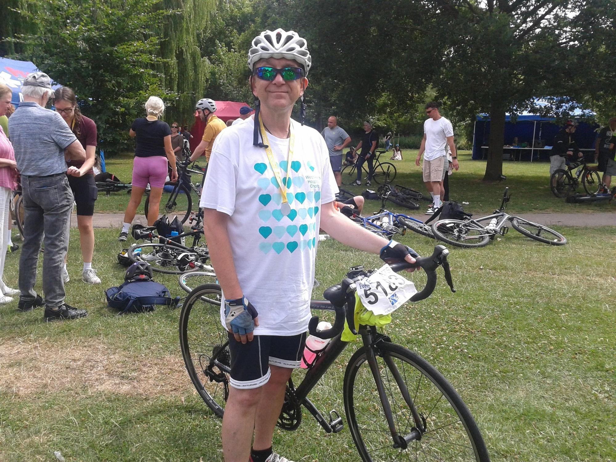 Hospital charity volunteer raises £1,000 with 57-mile bike ride in ...