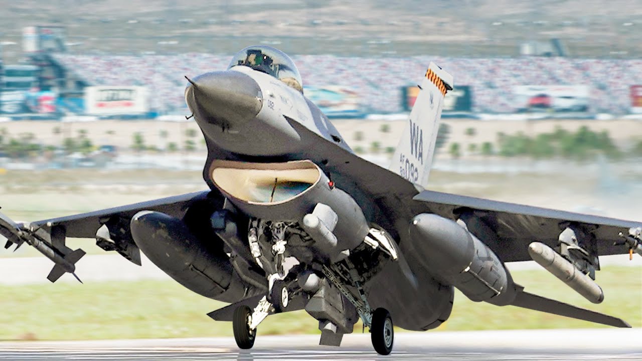US F-16 with full weapons load takes off powerfully with afterburner ...