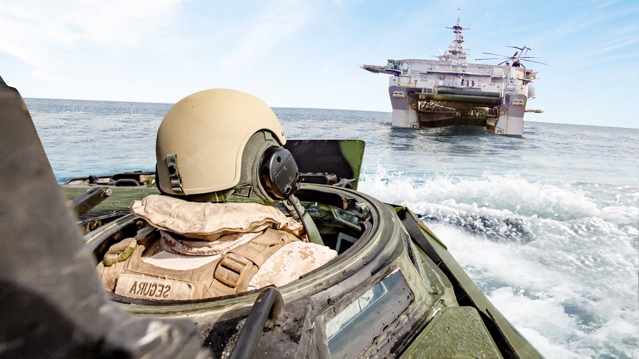 US Amphibious Vehicle Parks Inside Massive Ship at Sea