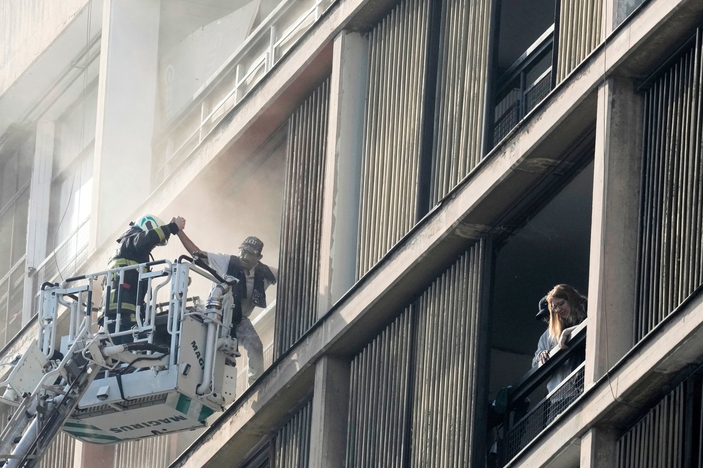 Firefighters rescue dozens from burning high rise in Santiago