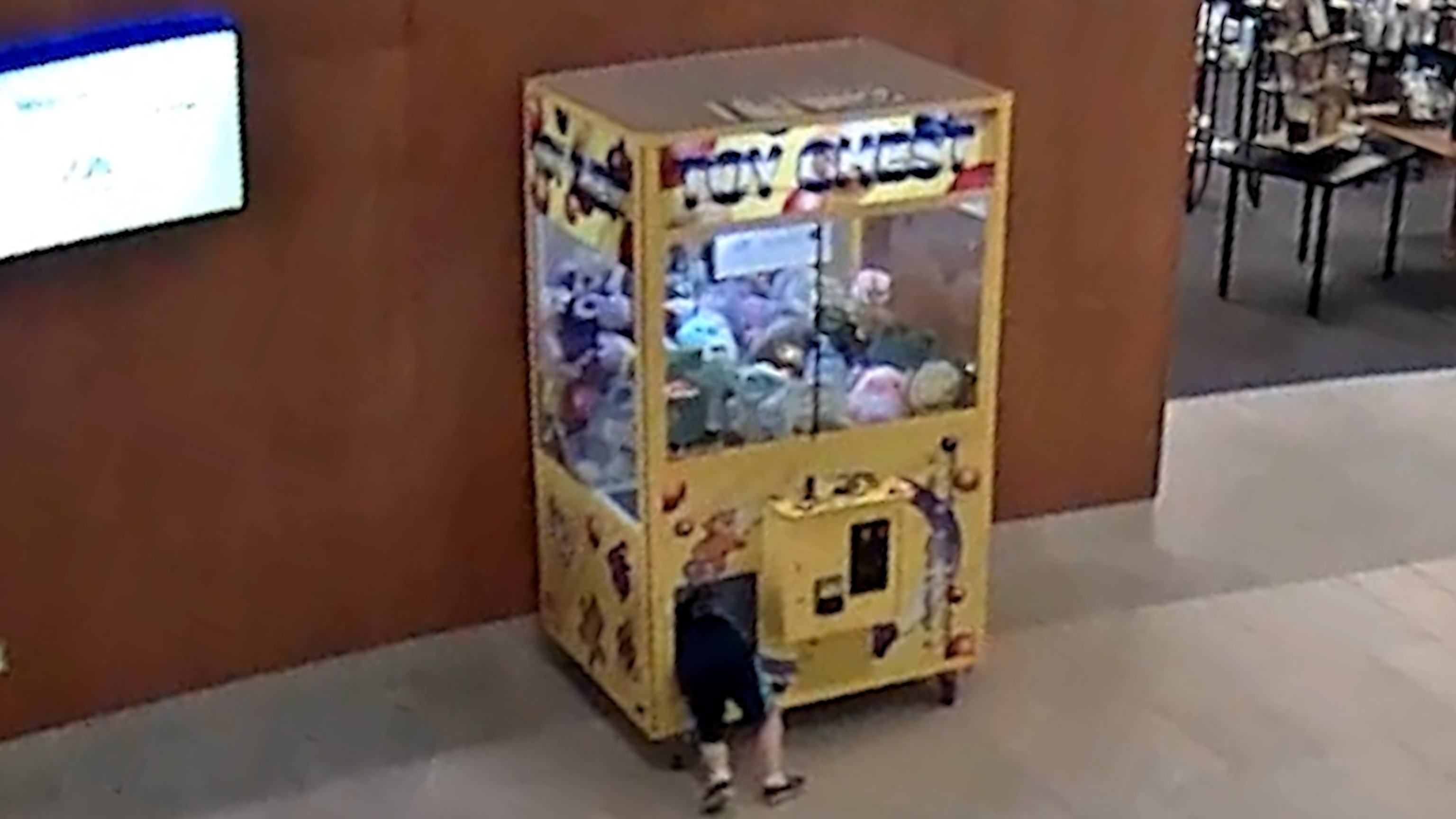 Child becomes trapped after crawling inside claw machine game