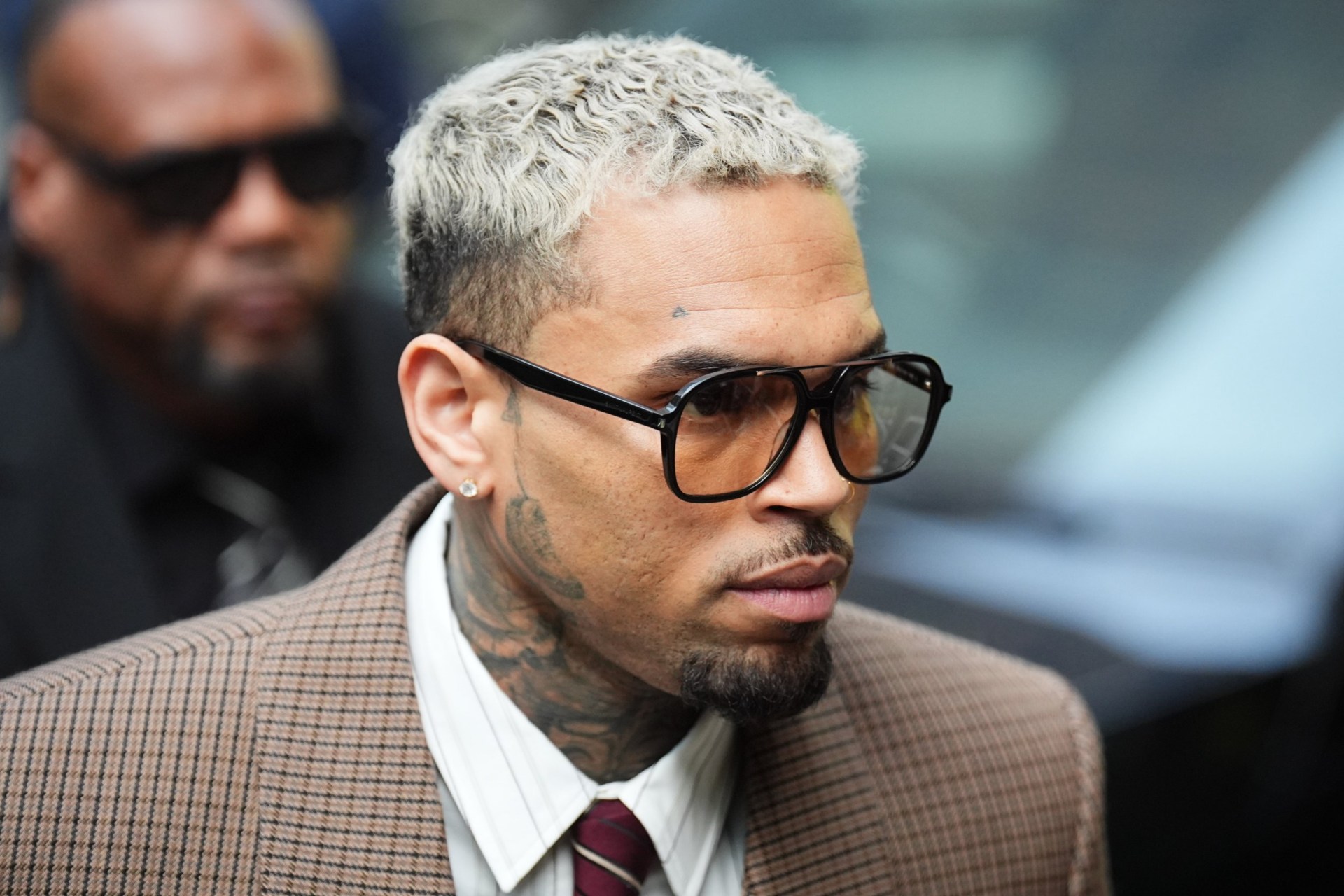 Chris Brown pleads not guilty to bottle attack