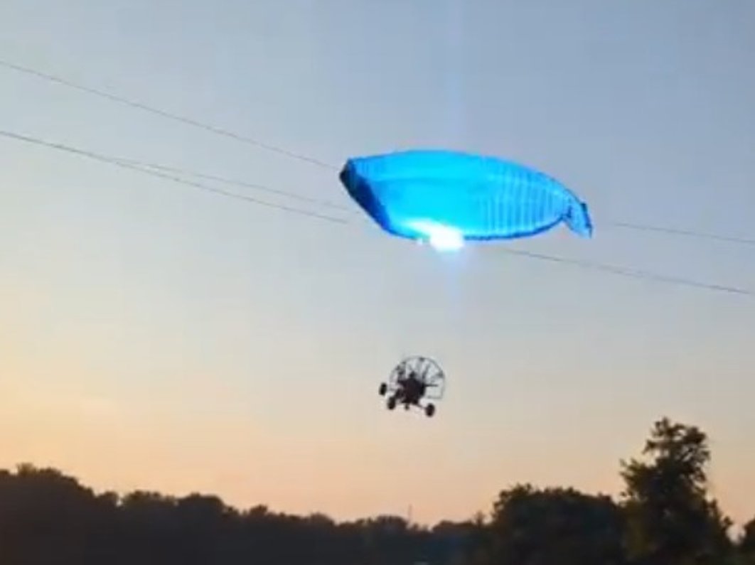 Paraglider crashes into power line