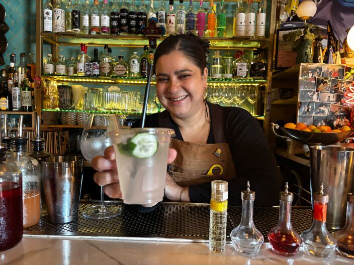 A new state law requires bars to provide lids to deter drink tampering