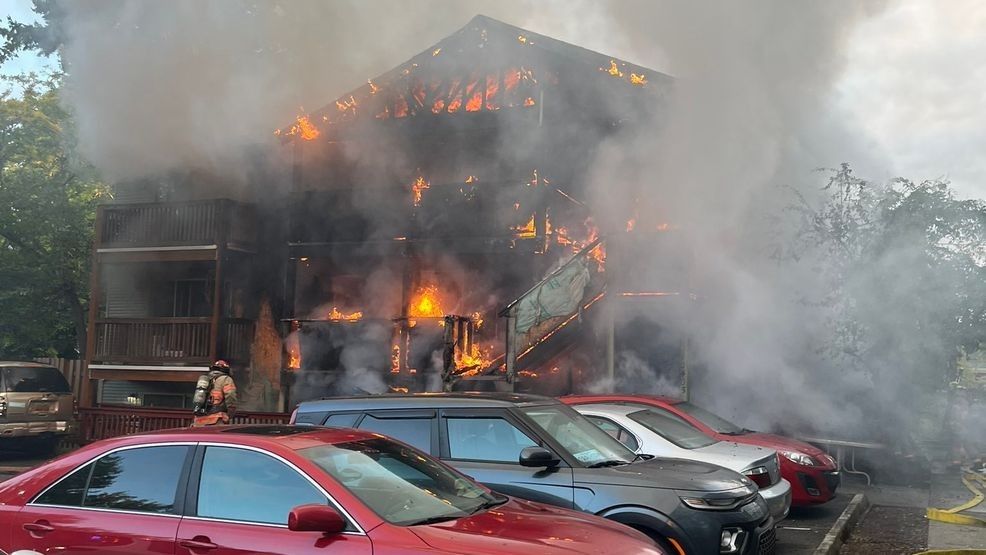 Eight people rescued and two jump to safety as 4-alarm fire rages in ...