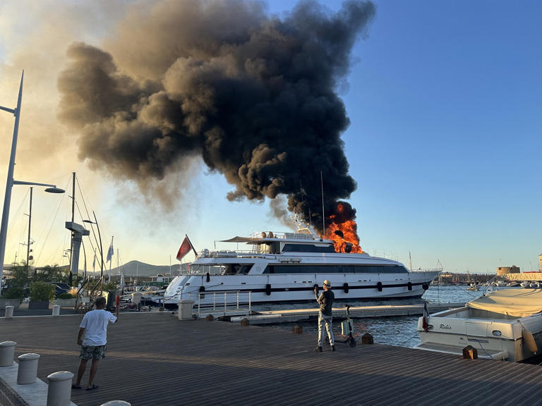 A luxurious superyacht you can charter for $76K a week bursts into ...