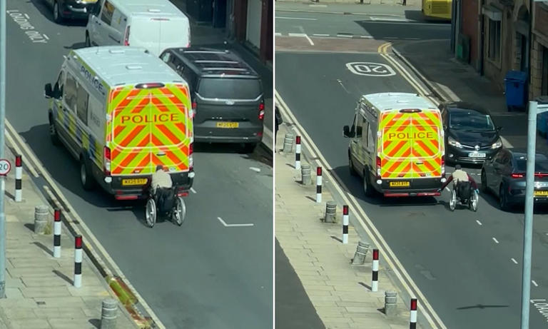 Moment wheelchair user shocks witnesses by clinging to moving police van