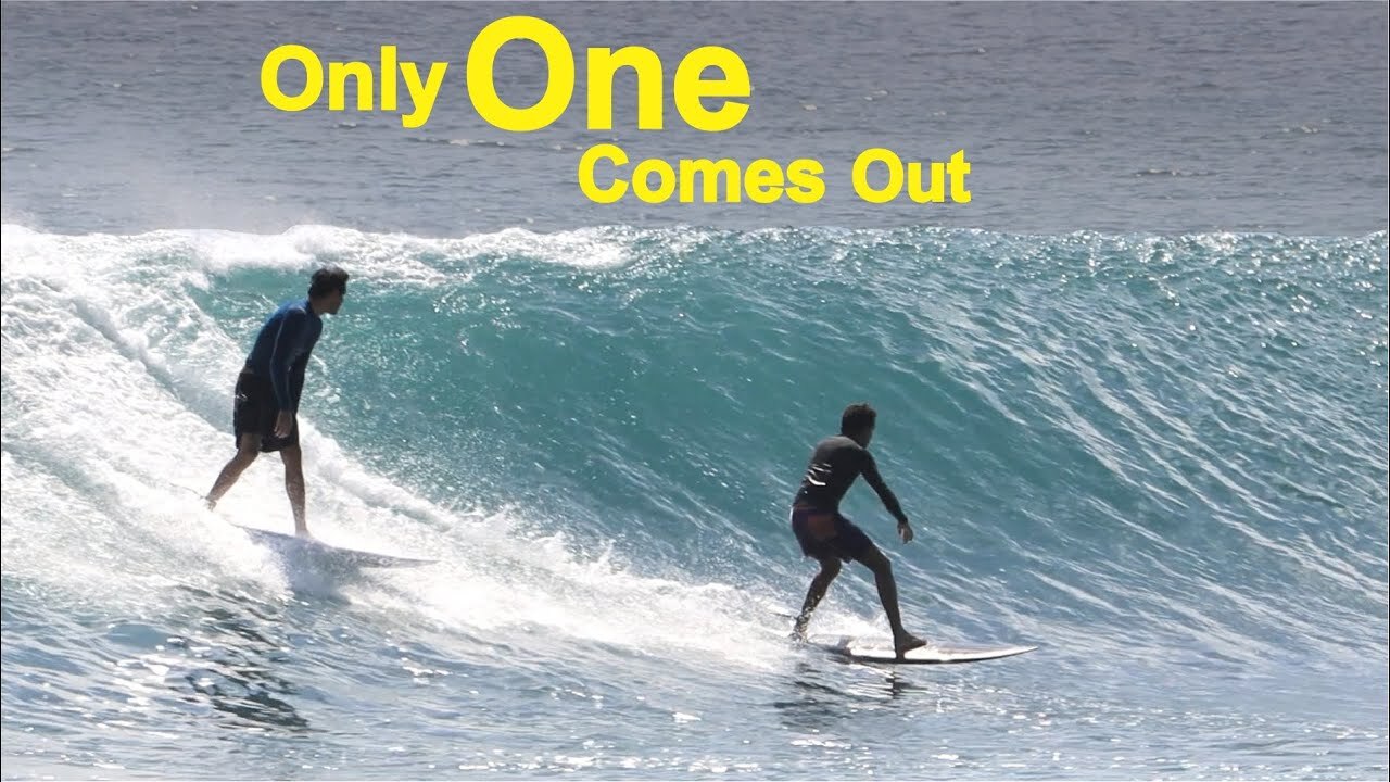 Surfers experience the thrill of a tube ride at Uluwatu