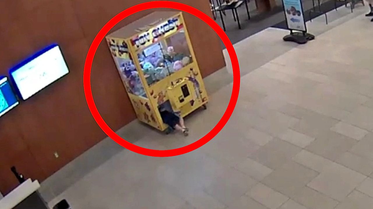 Child crawls into claw machine, gets stuck