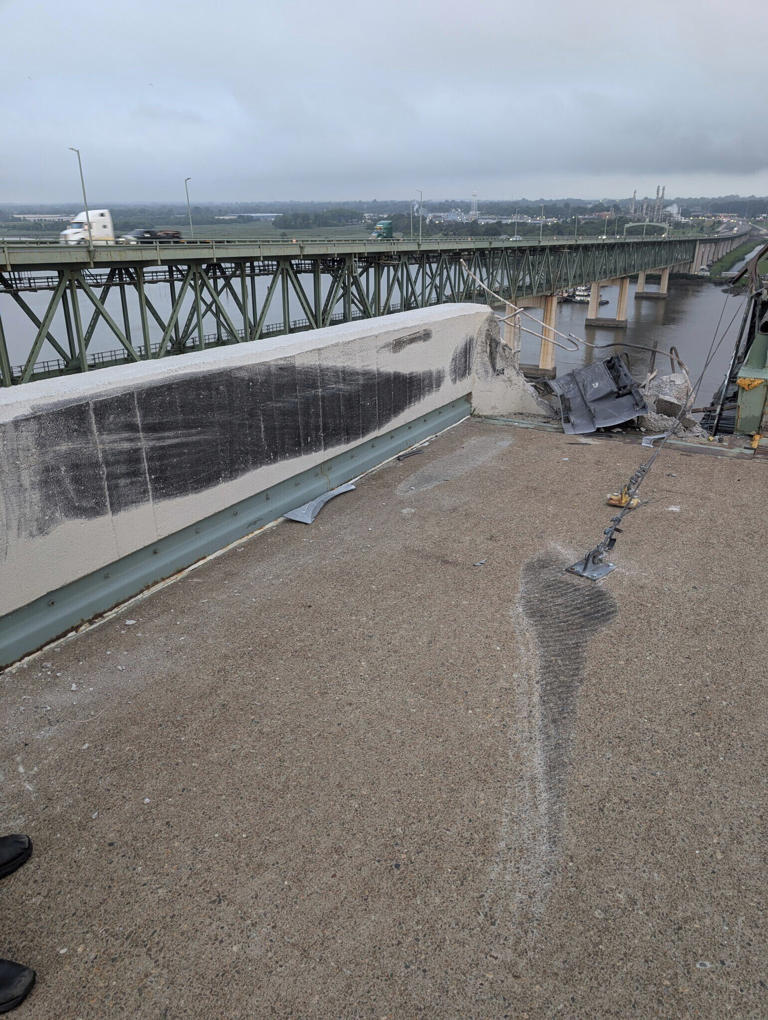 Lorry cab plunges off bridge and leaves driver missing