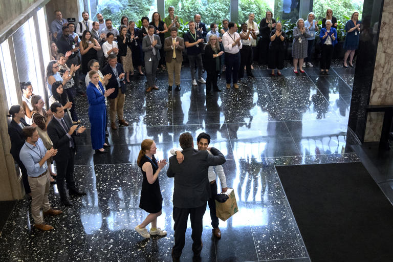 Applause as teary State Department workers exit after mass firings