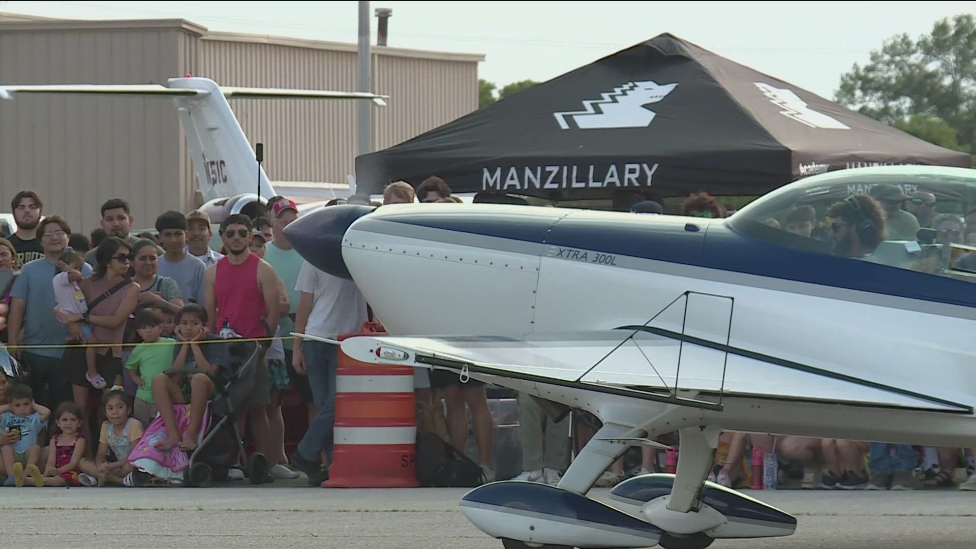 Cars race planes at Springdale airport