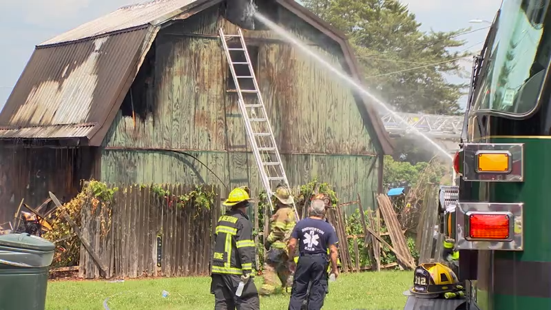 Firefighters struggle to stay cool during abnormally hot July weather