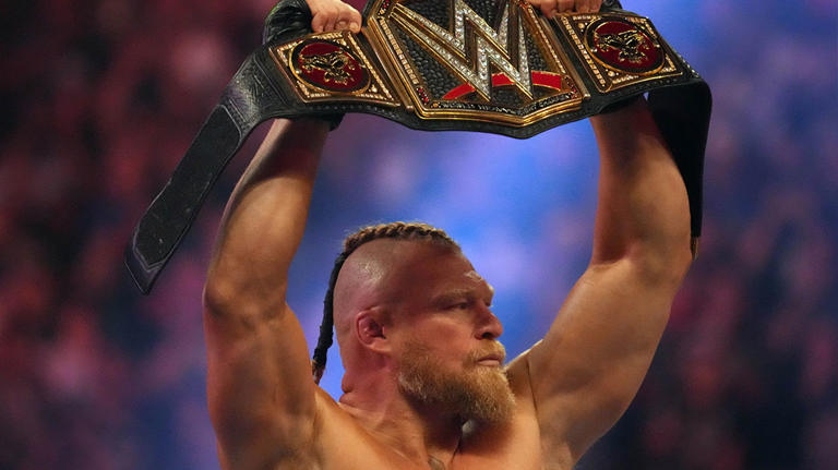 WWE’s Brock Lesnar puts fan in 'headlock' at meet & greet