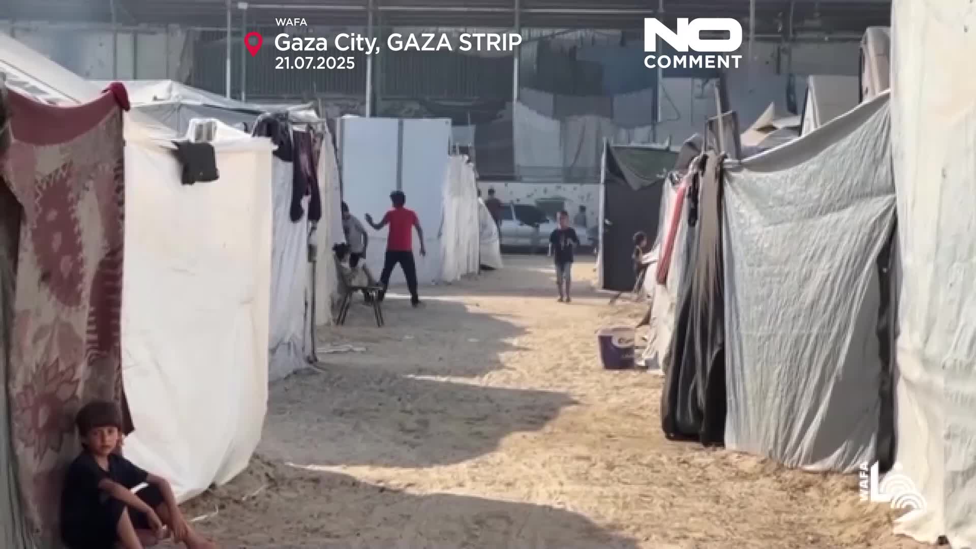 Displaced Gazans live in tents at bombed stadium in Gaza City