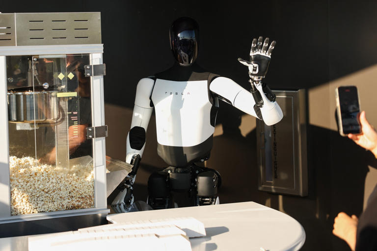 Robots serving popcorn, cybertruck food boxes and 66ft movie screens ...