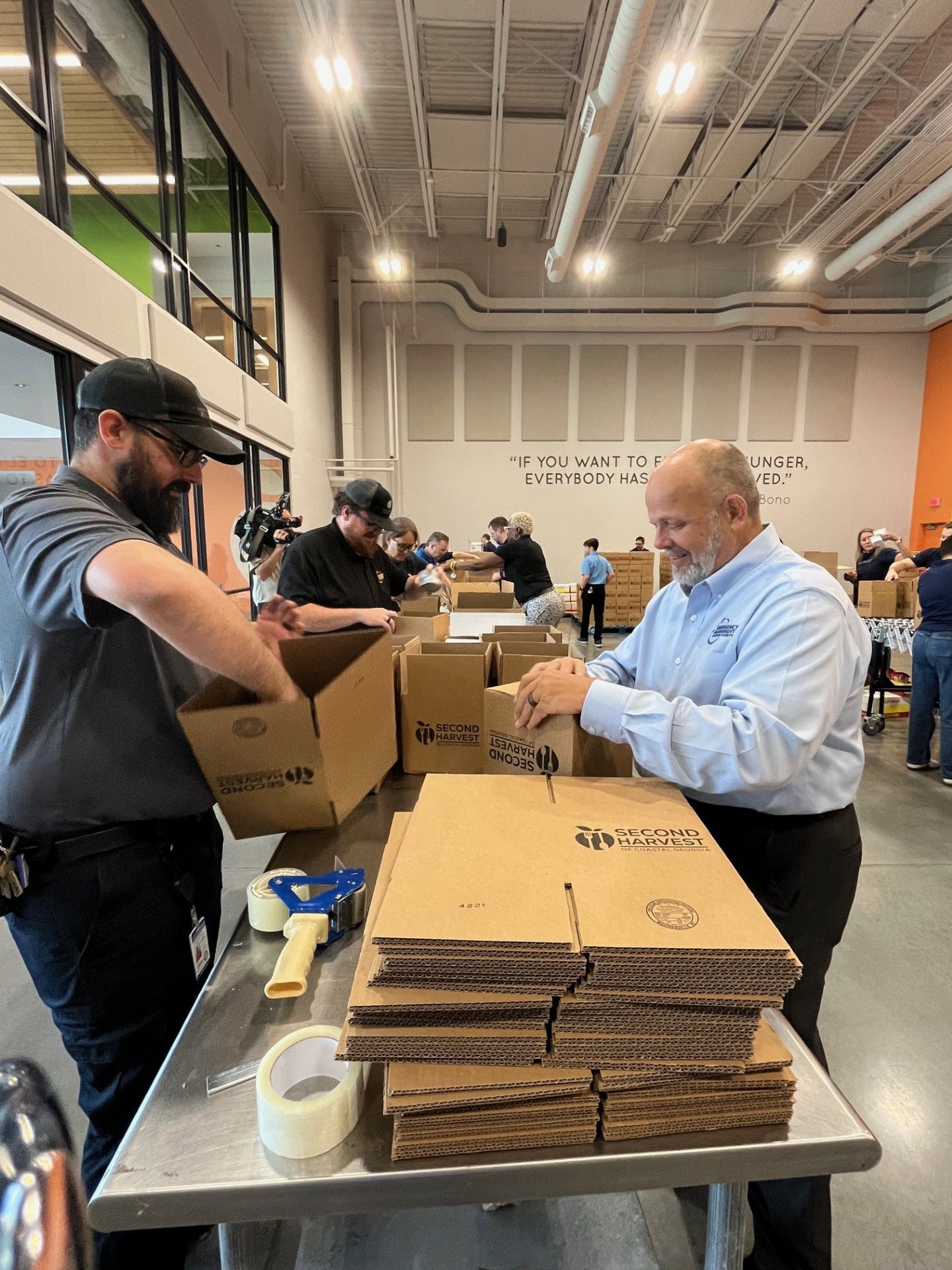 Second Harvest busy packing food boxes ahead of what is predicted to be ...