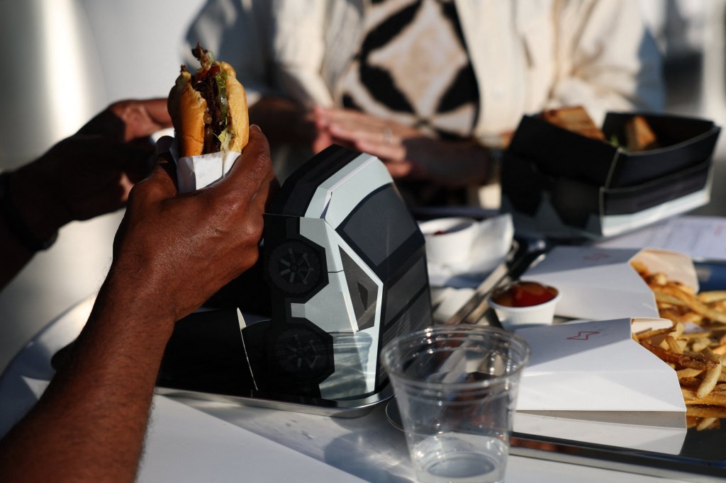 Inside Elon Musk’s Tesla diner where robots serve the food