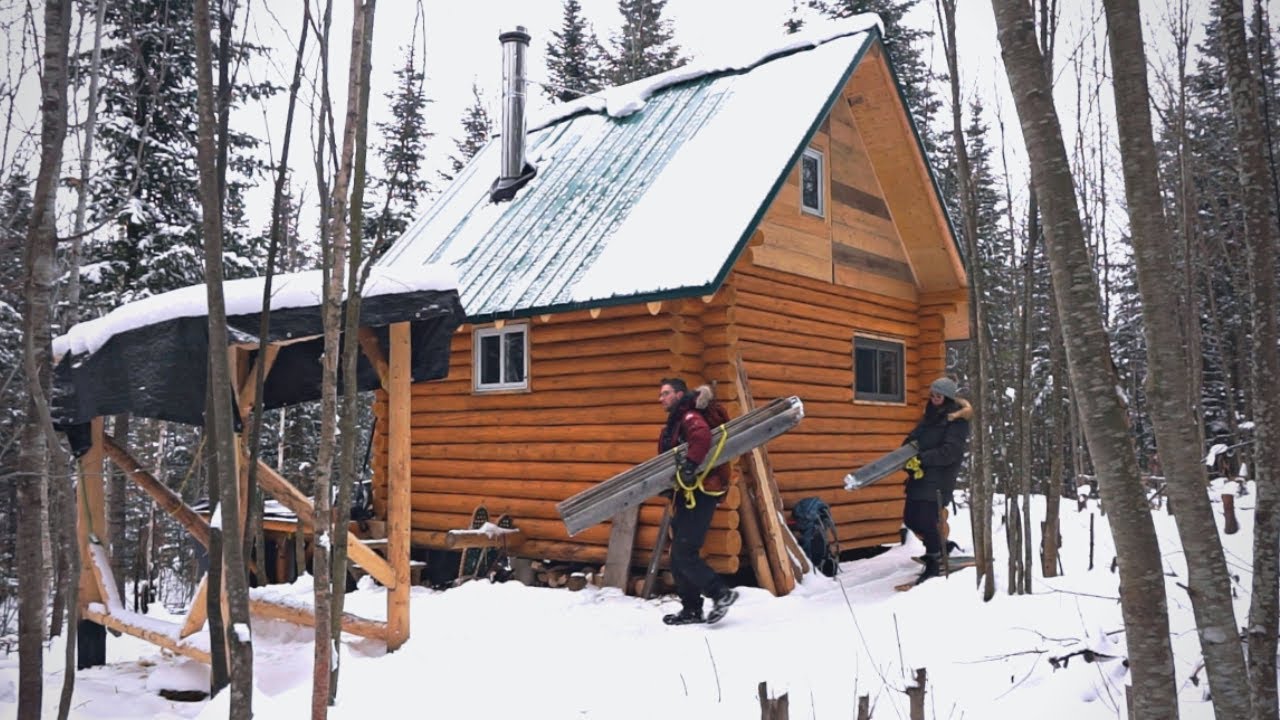 Building A Log Cabin | Ep. 45 | First night at the cabin! Winter's here ...