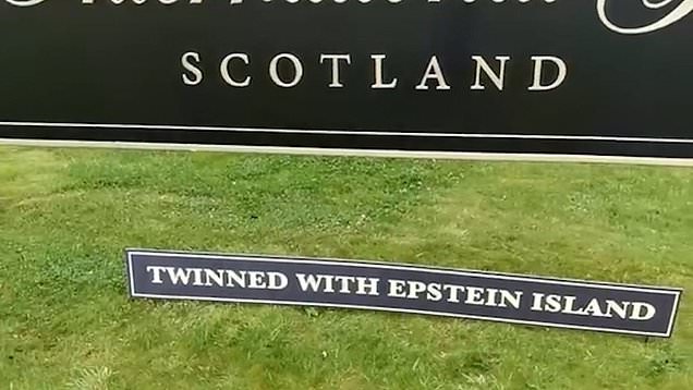 Sign reading 'Twinned with Epstein Island' appears at Trump golf course.