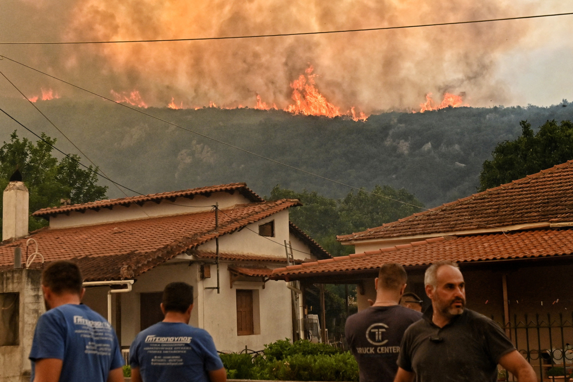 Wildfire in Greece forces evacuations as the country battles extreme heat