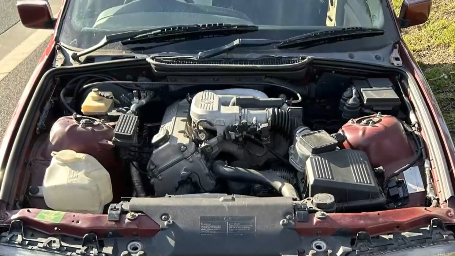 BMW pulled over without bonnet, driver's seat in Melbourne