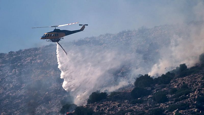 Firefighting helicopter crashes into sea trying to collect water as ...