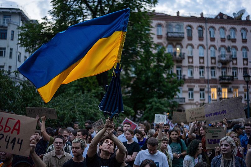 Thousands gather in Ukraine to protest as Zelenskyy signs bill ...