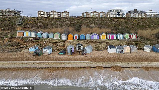 Local council removes £1million cliffside beach huts at risk of falling ...