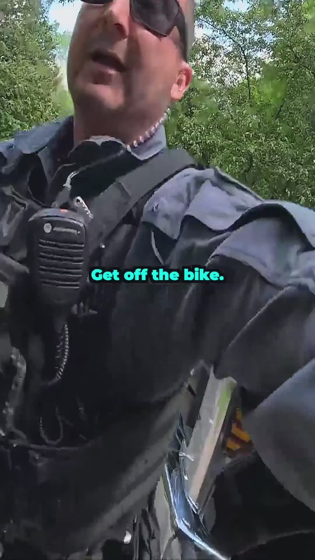 Police officer tackles biker off of his motorcycle