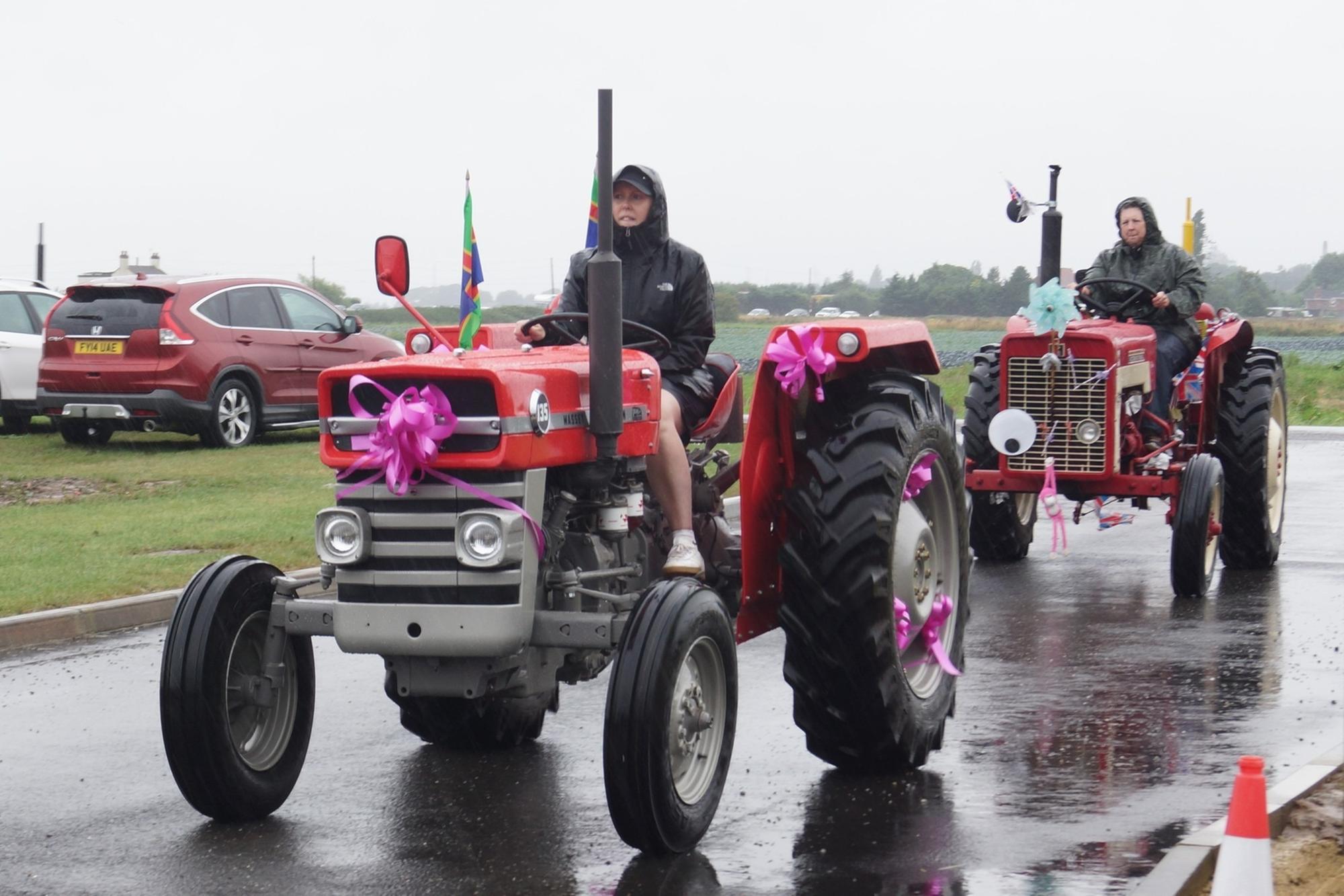 Tractor-driving fundraisers endure wind and rain to raise thousands for ...
