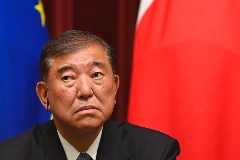 Japanese leader Ishiba vows to remain in power despite speculation