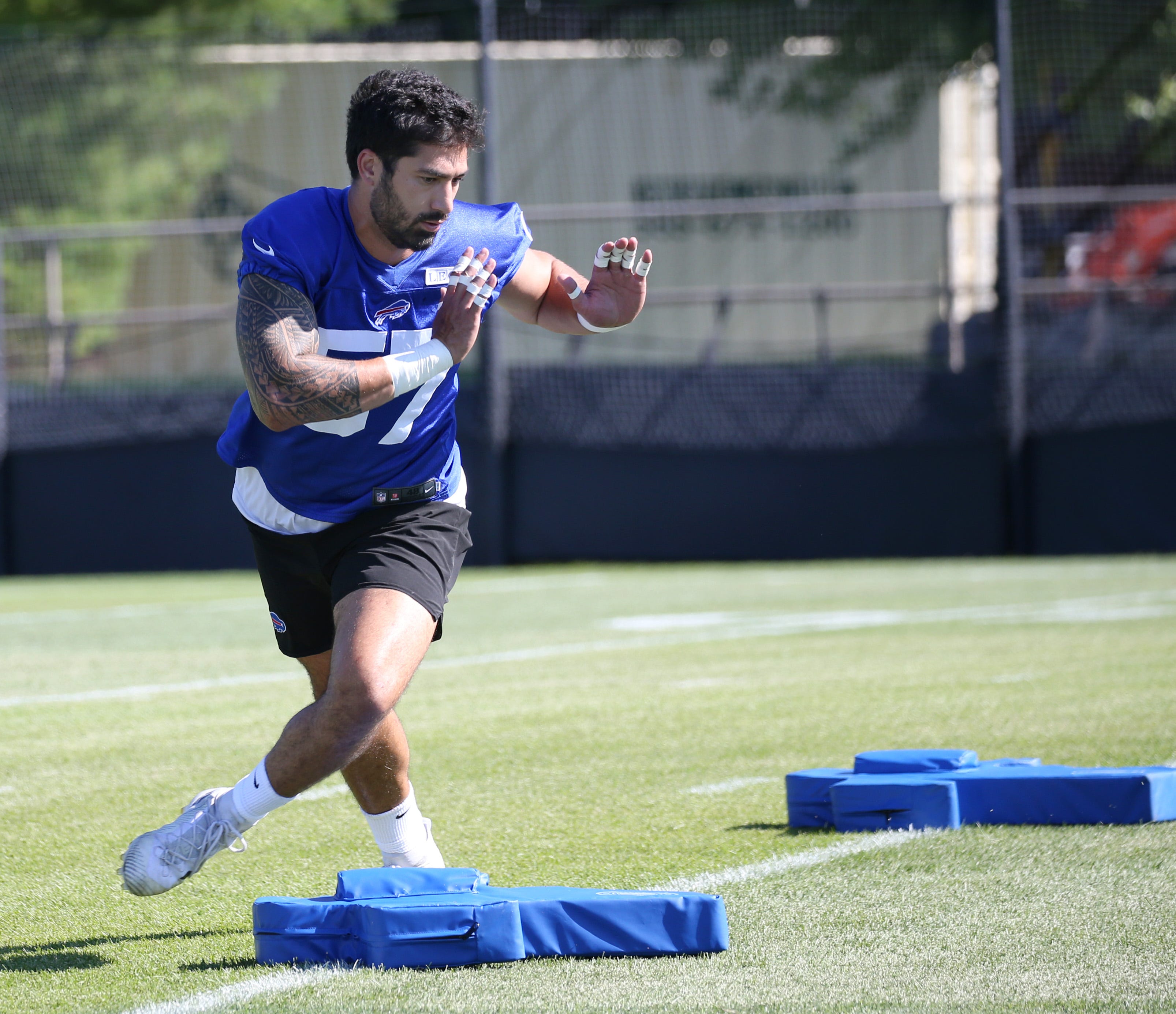 Bills defensive end's off-season hobby? Catching massive pythons with his bare hands