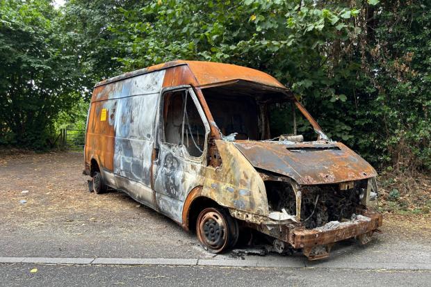 Fly-tipper abandons fire-destroyed van on public road